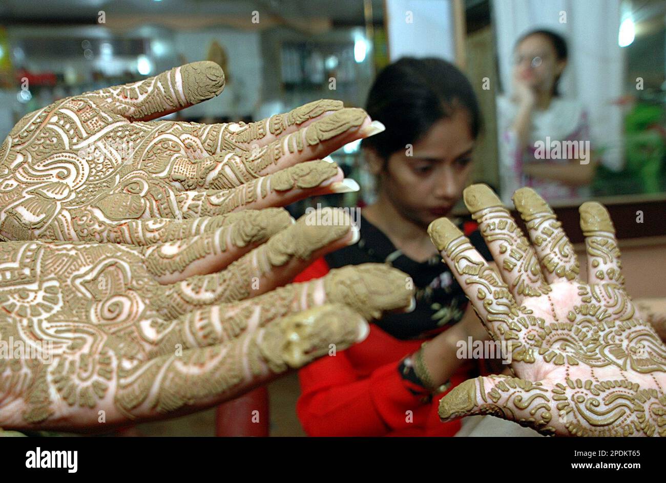 Pakistani girls show their hands painted with henna ahead of the Muslim ...