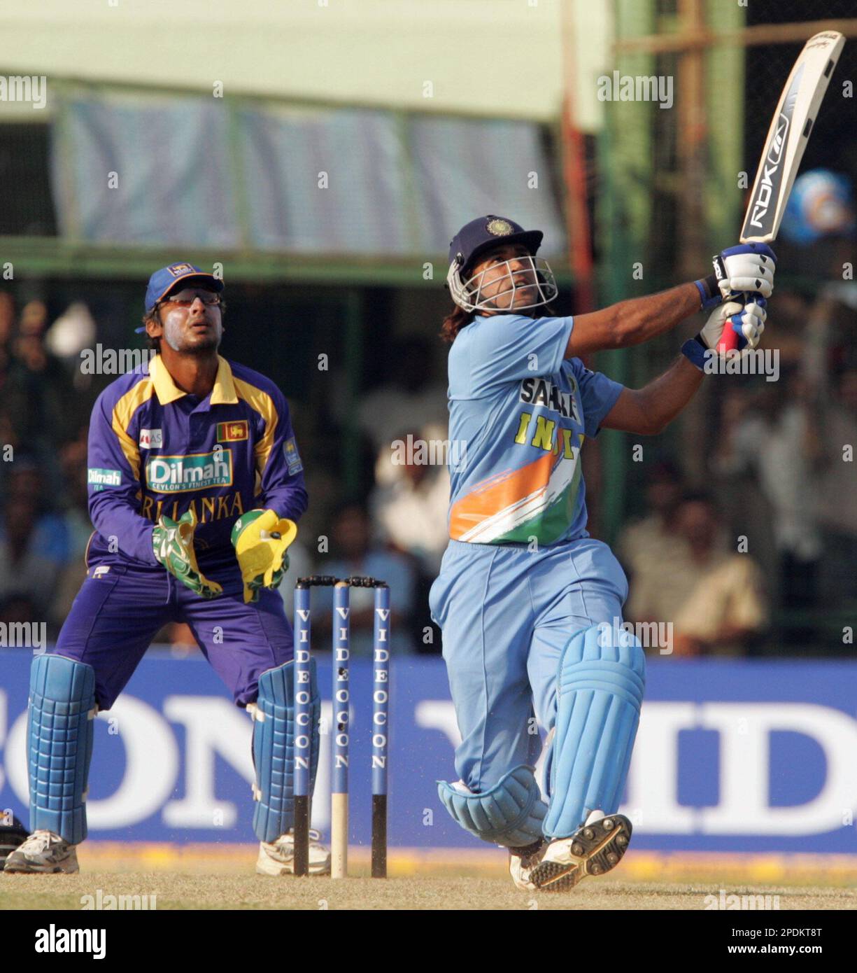 India's M.S. Dhoni, right, hits the winning runs as Sri Lanka's Kumar ...