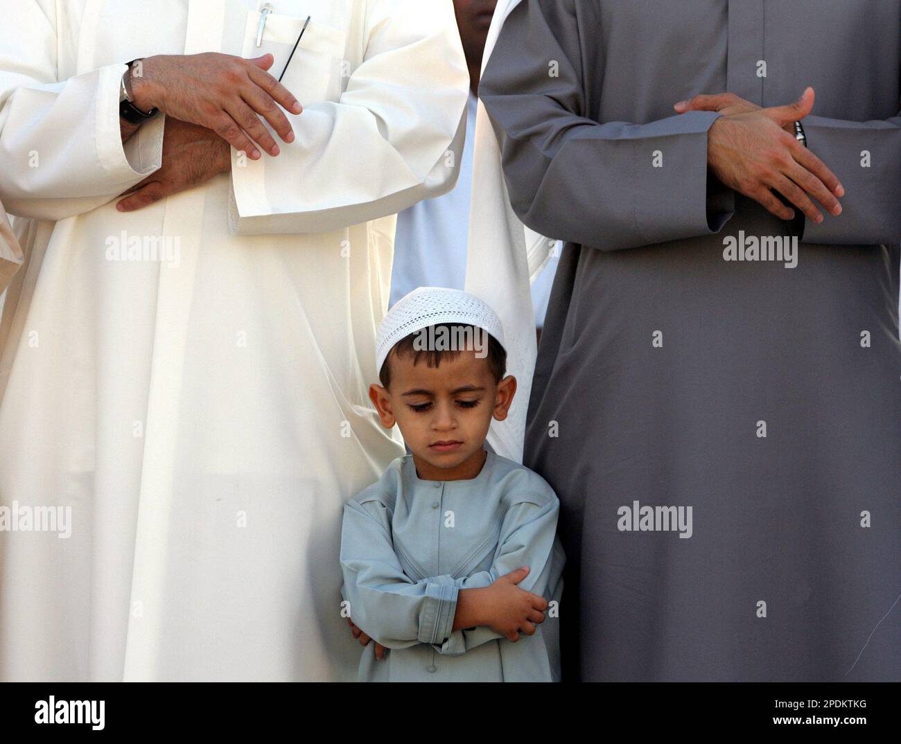 A boy performs the prayers during the Eid al-Fitr prayers at the end of ...