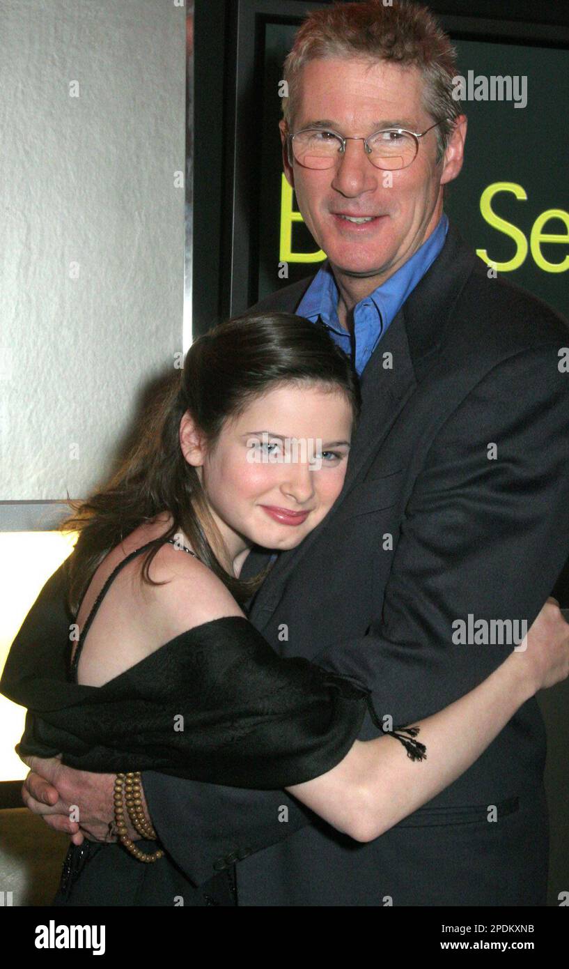 Flora Cross, left, and Richard Gere embrace as they pose for ...