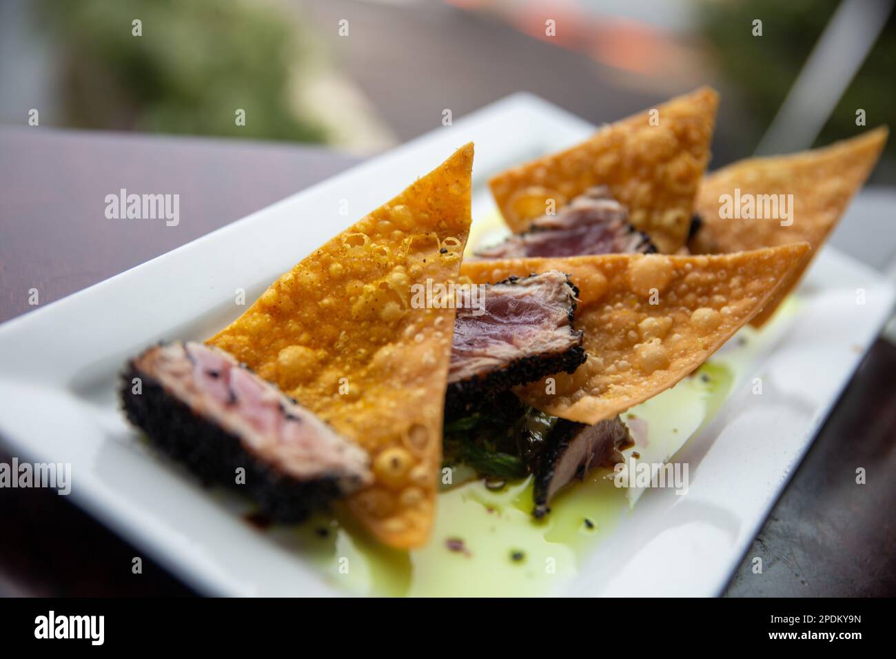 Seared Ahi Tuna with Fresh Nacho Chips Stock Photo - Alamy
