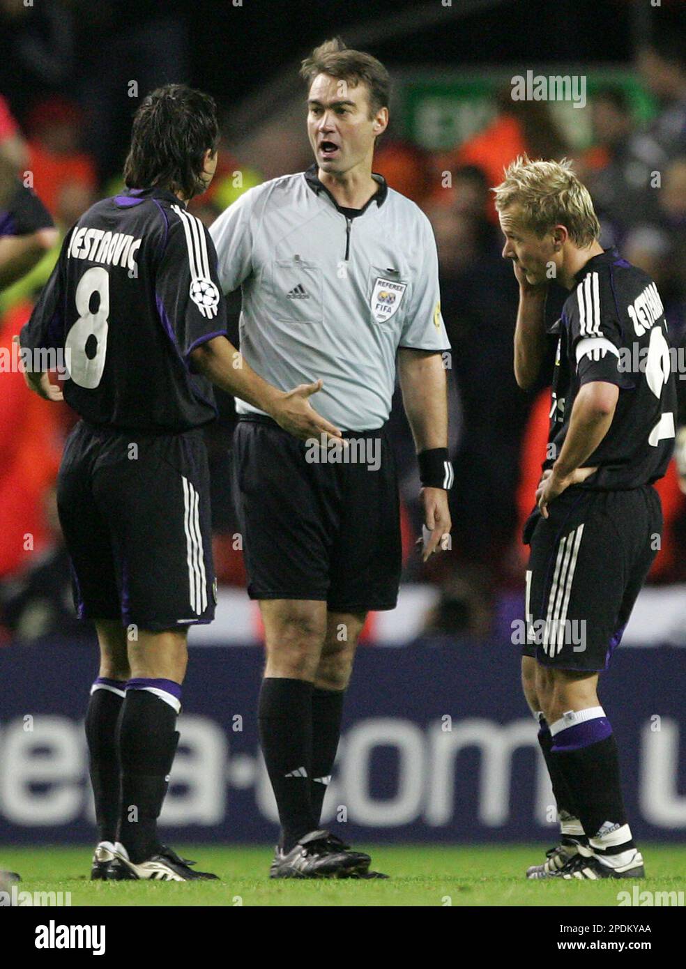 Anderlecht's Nenad Jestrovic, left, pleads with referee Kim Milton ...