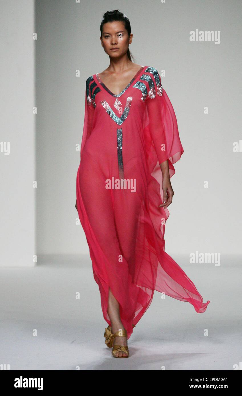 Thai model walks on the catwalk showing a design by Thai designer ...