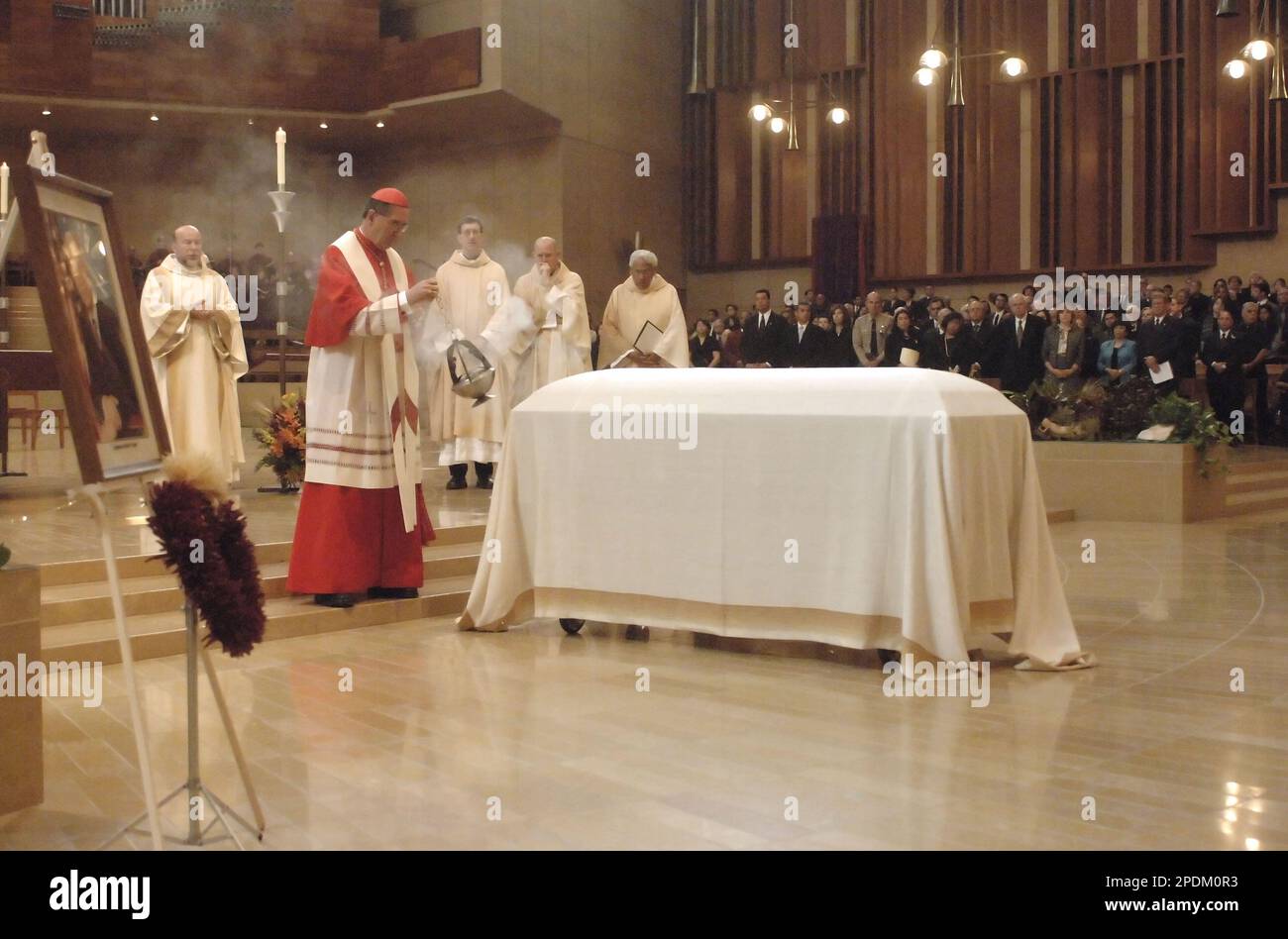 Cardinal Roger Mahony prays during the funeral of former Congressman ...