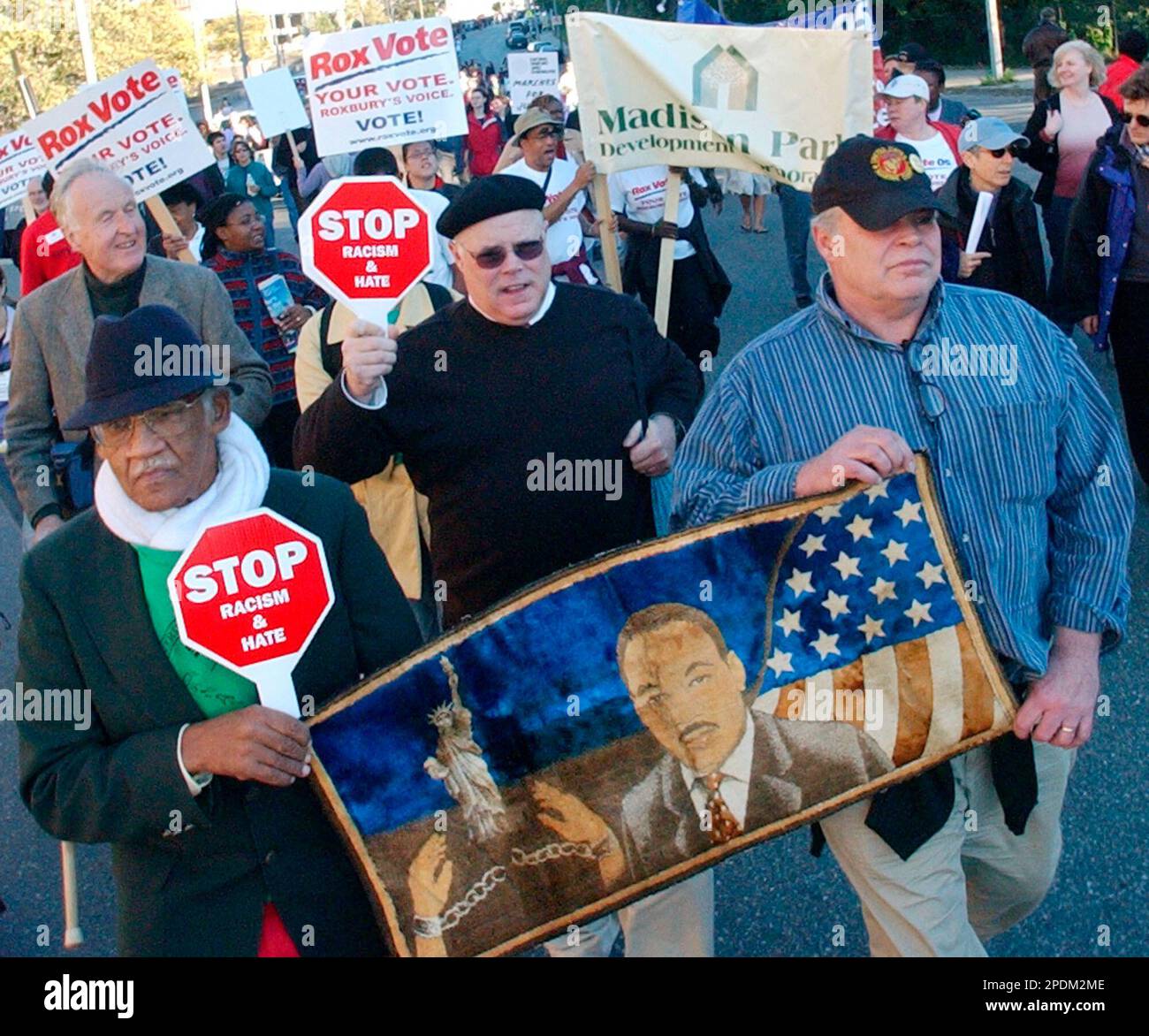 Walter Barboza, of Hyannis, Mass., left, walks with John Bangert, of ...