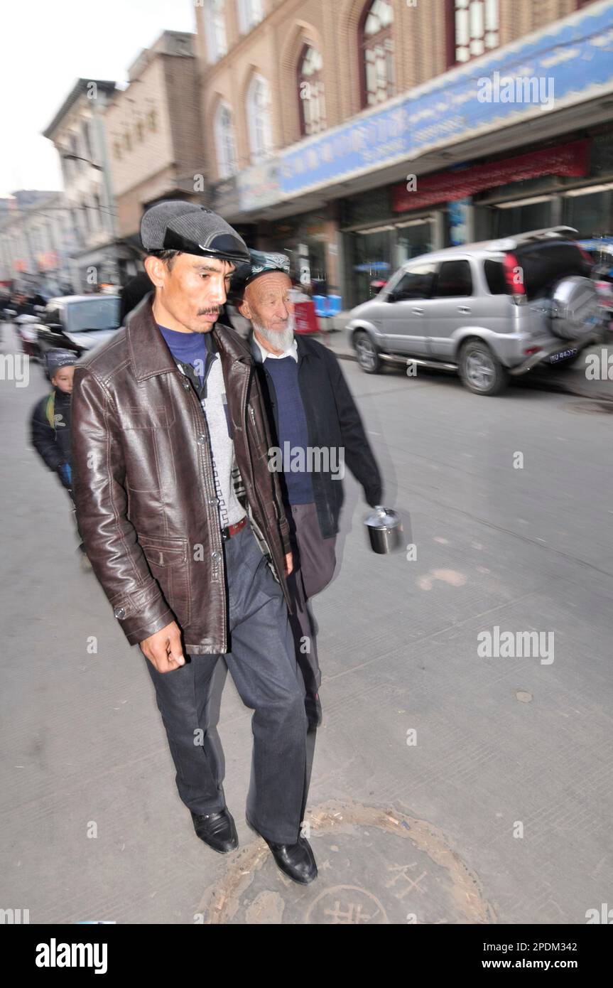 Uyghur men walking hi-res stock photography and images - Alamy