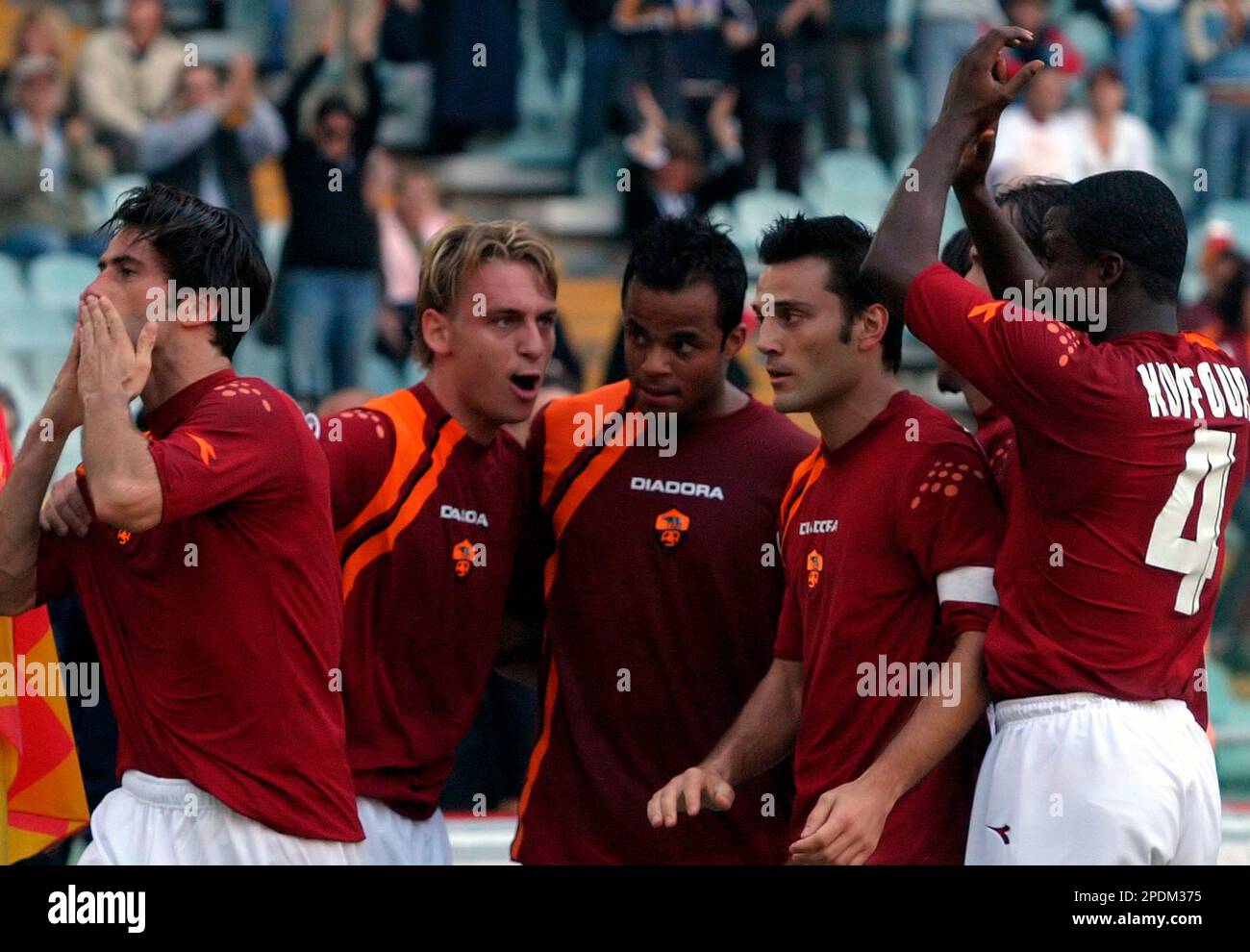 Roma's Christian Panucci, left, celebrates with his teammates after ...