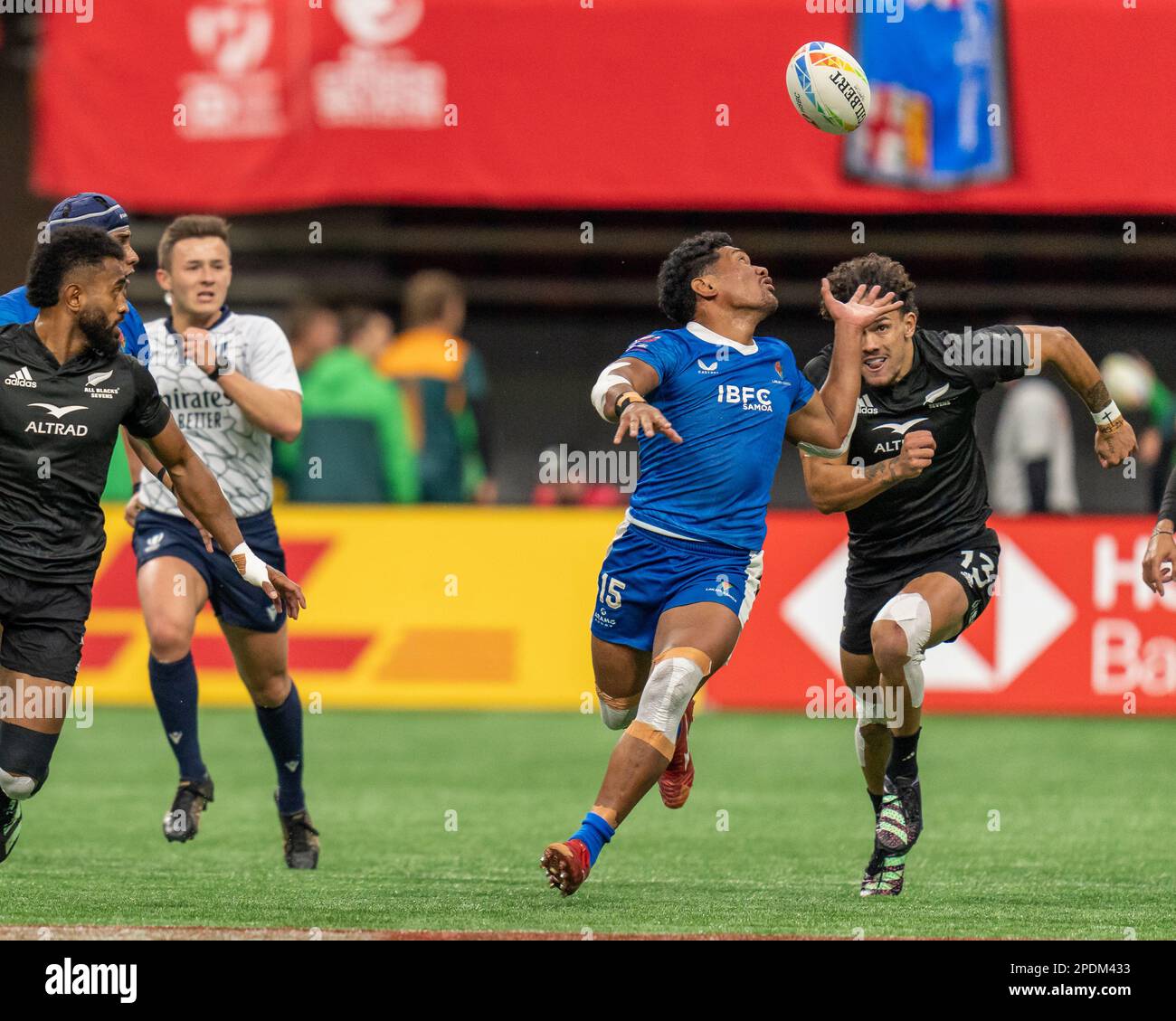 Vancouver, Canada. 4th March, 2023. Faafoi Falaniko (C) of Samoa passes ...