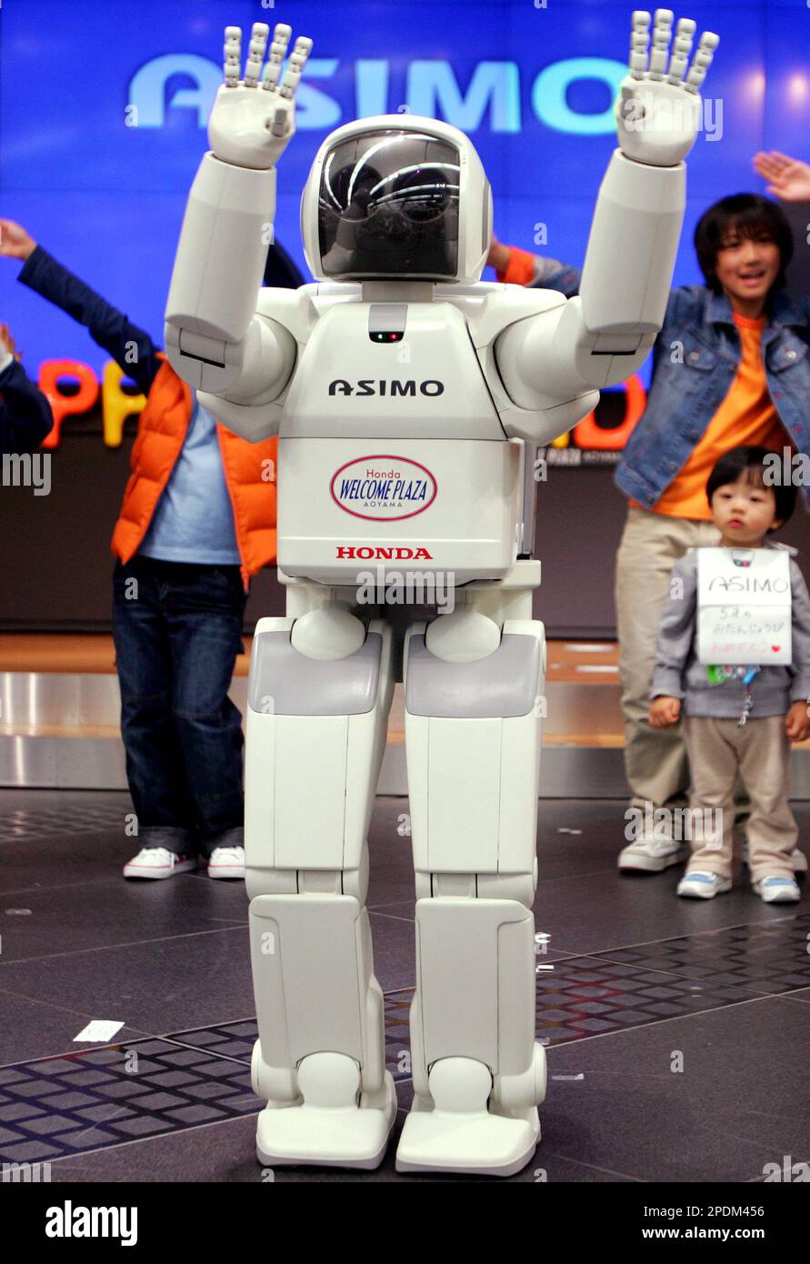 Honda Motor Co., humanoid robot ASIMO, dances with school children ...