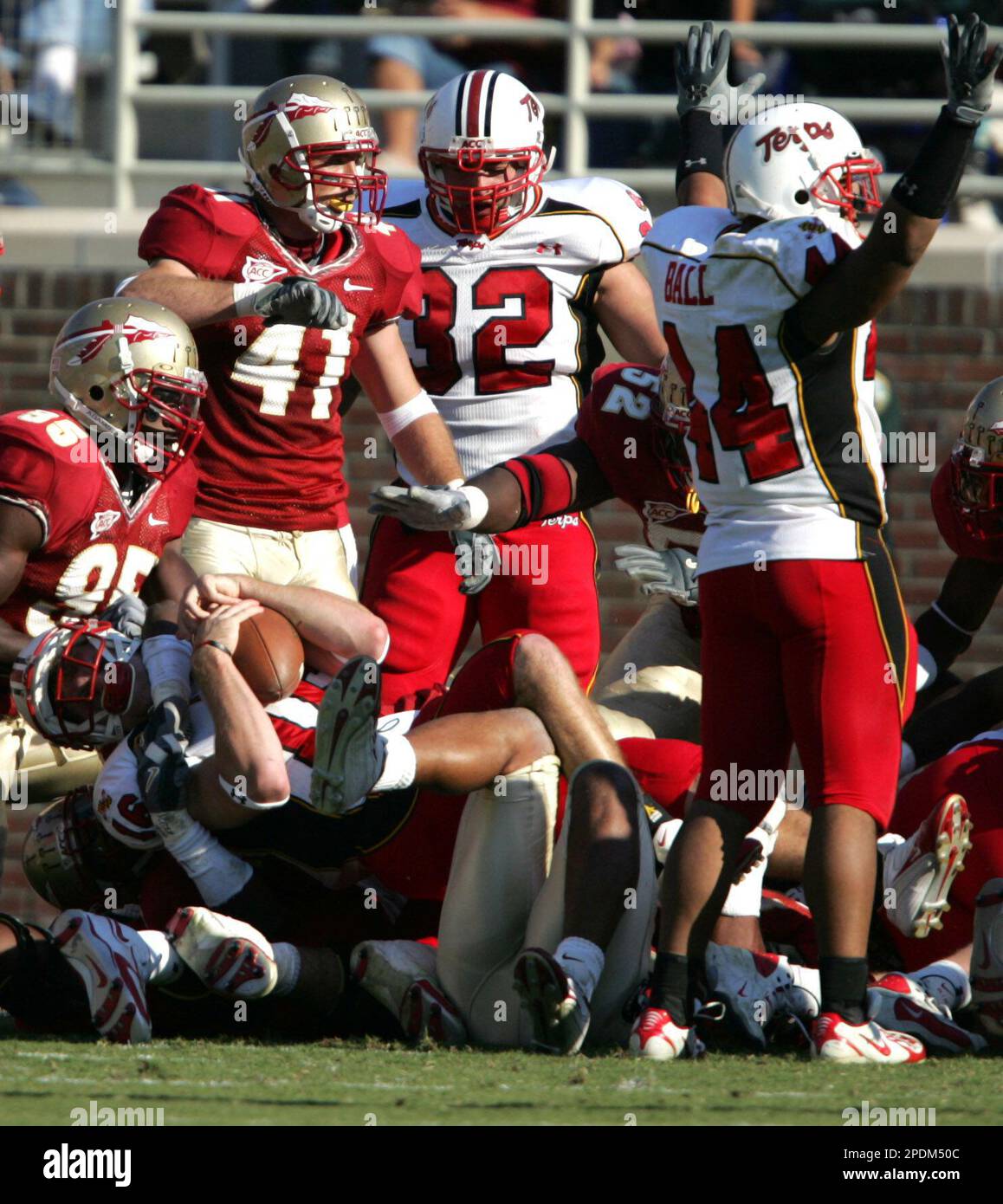 Maryland's quarterback Joel Statham sits atop the stack after scoring ...