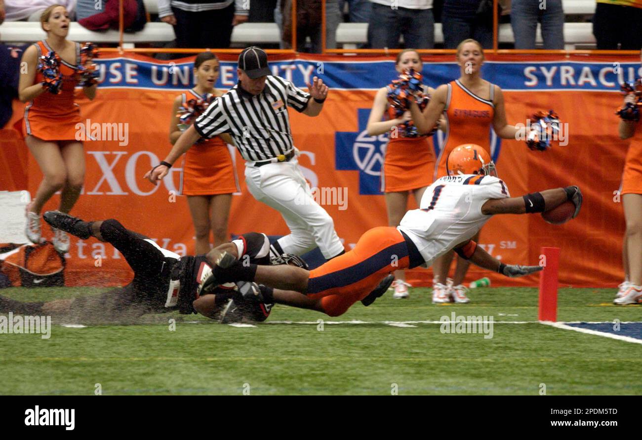 Syracuse's Damien Rhodes is caught from behind by Cincinnati's Mike ...
