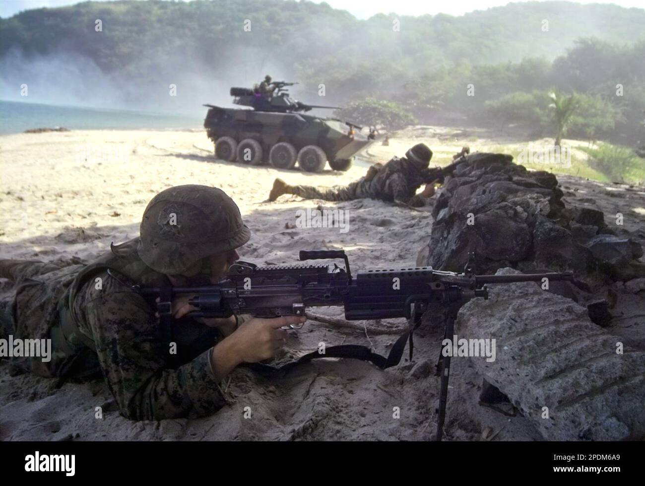 U.S. Marines take their positions at a beach landing exercise with ...