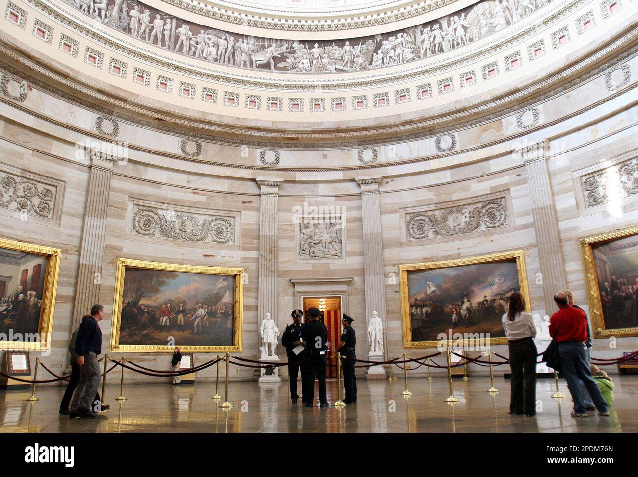 Capitol police officers and visitors walks are seen in the Capitol ...