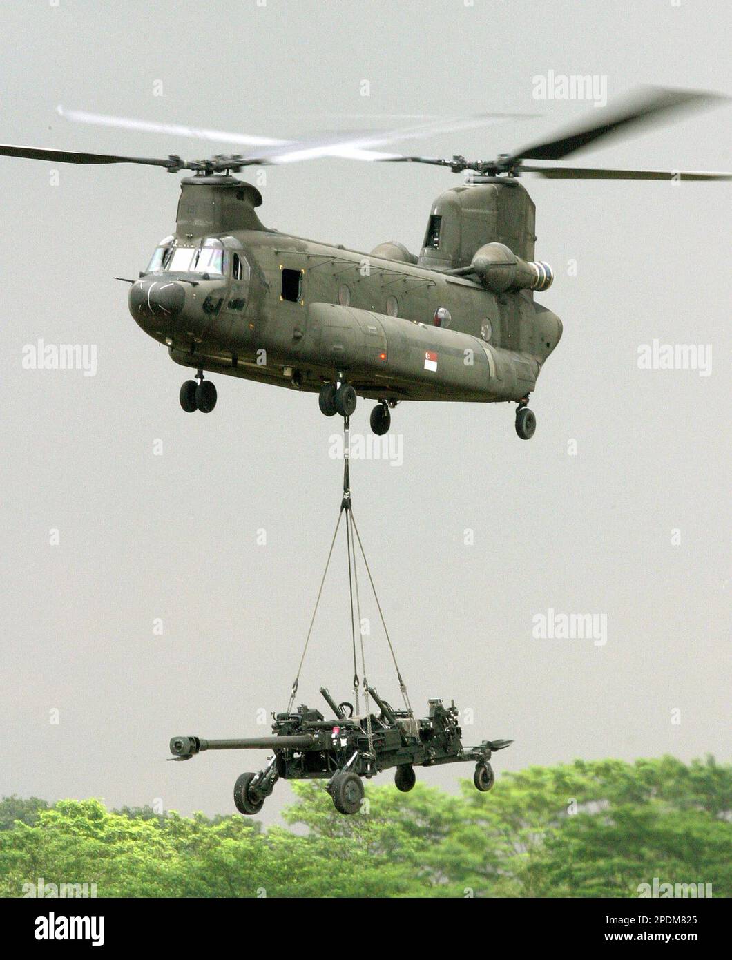 A Singapore Army CH-47D Chinook airlifts the Pegasus, a heli-portable ...