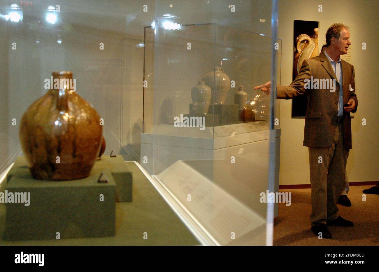 North Carolina potter Mark Hewitt leads a tour through a new exhibit of ...