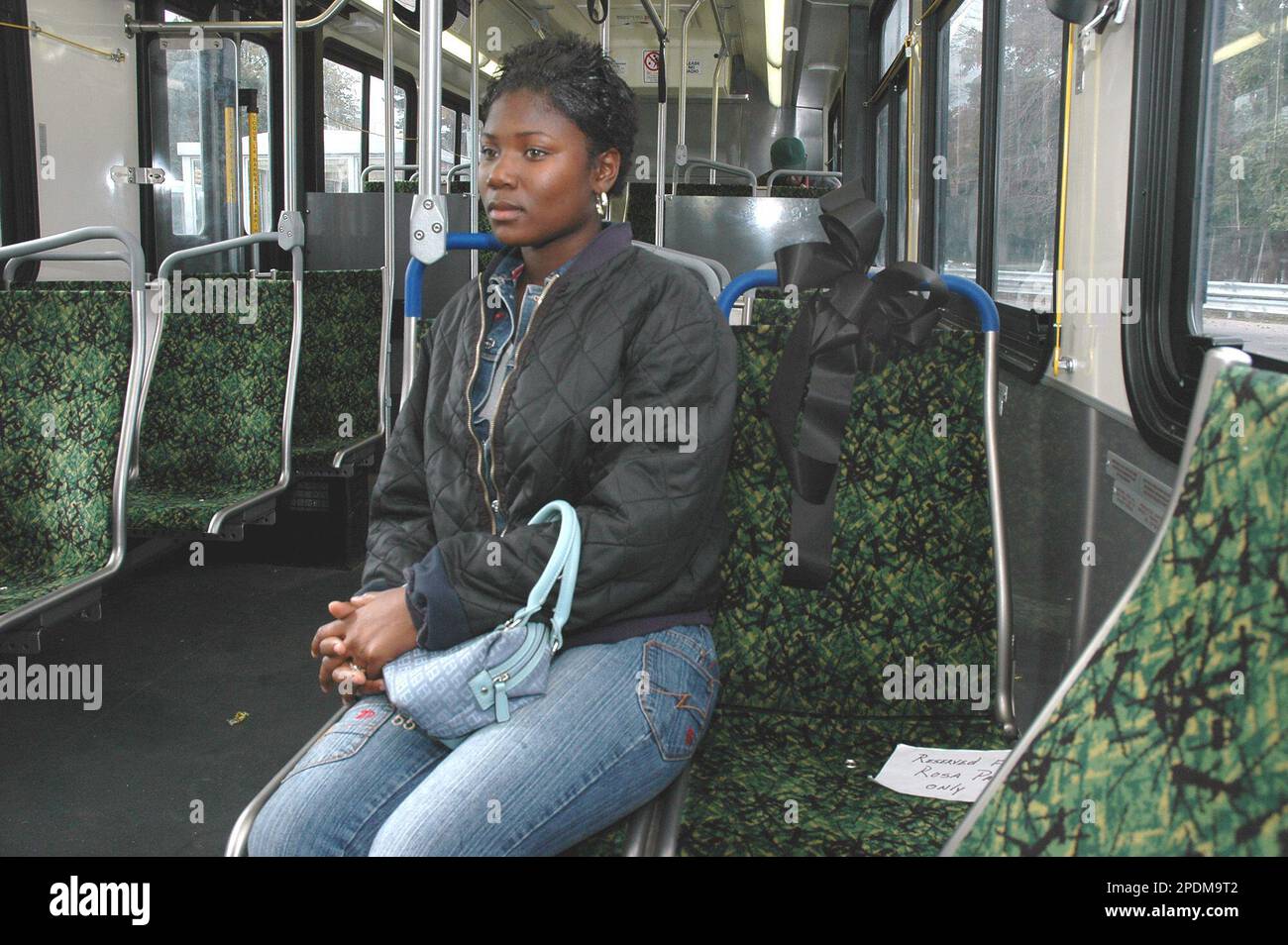 Ashley Farrow, 17, of Detroit, sits next to a seat with a black ribbon ...
