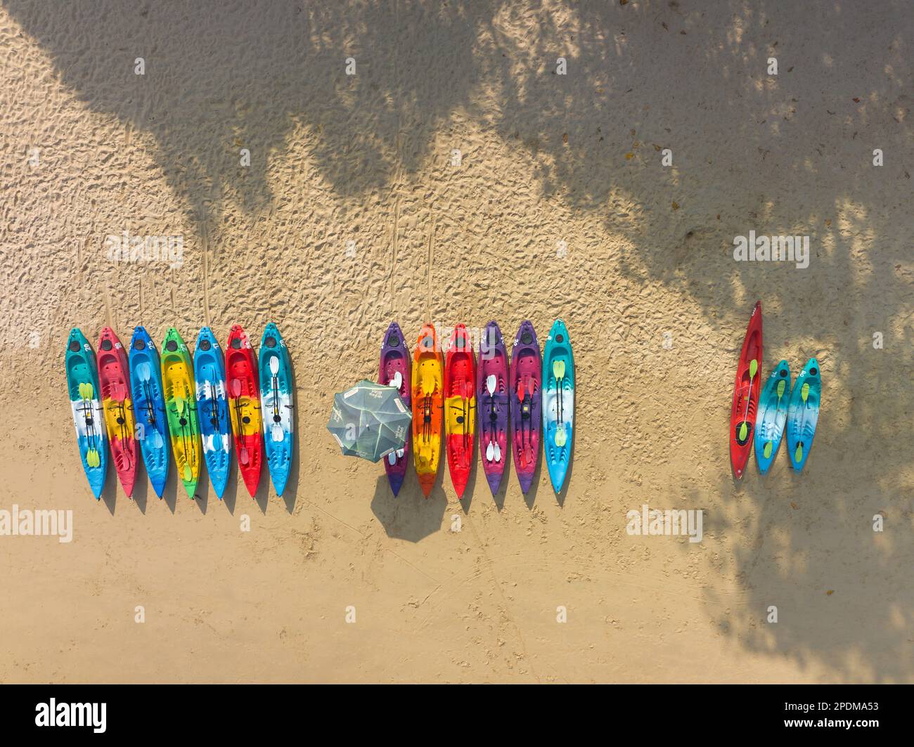 Aerial top view Colorful canoes are lined up in front of the beach. The ...