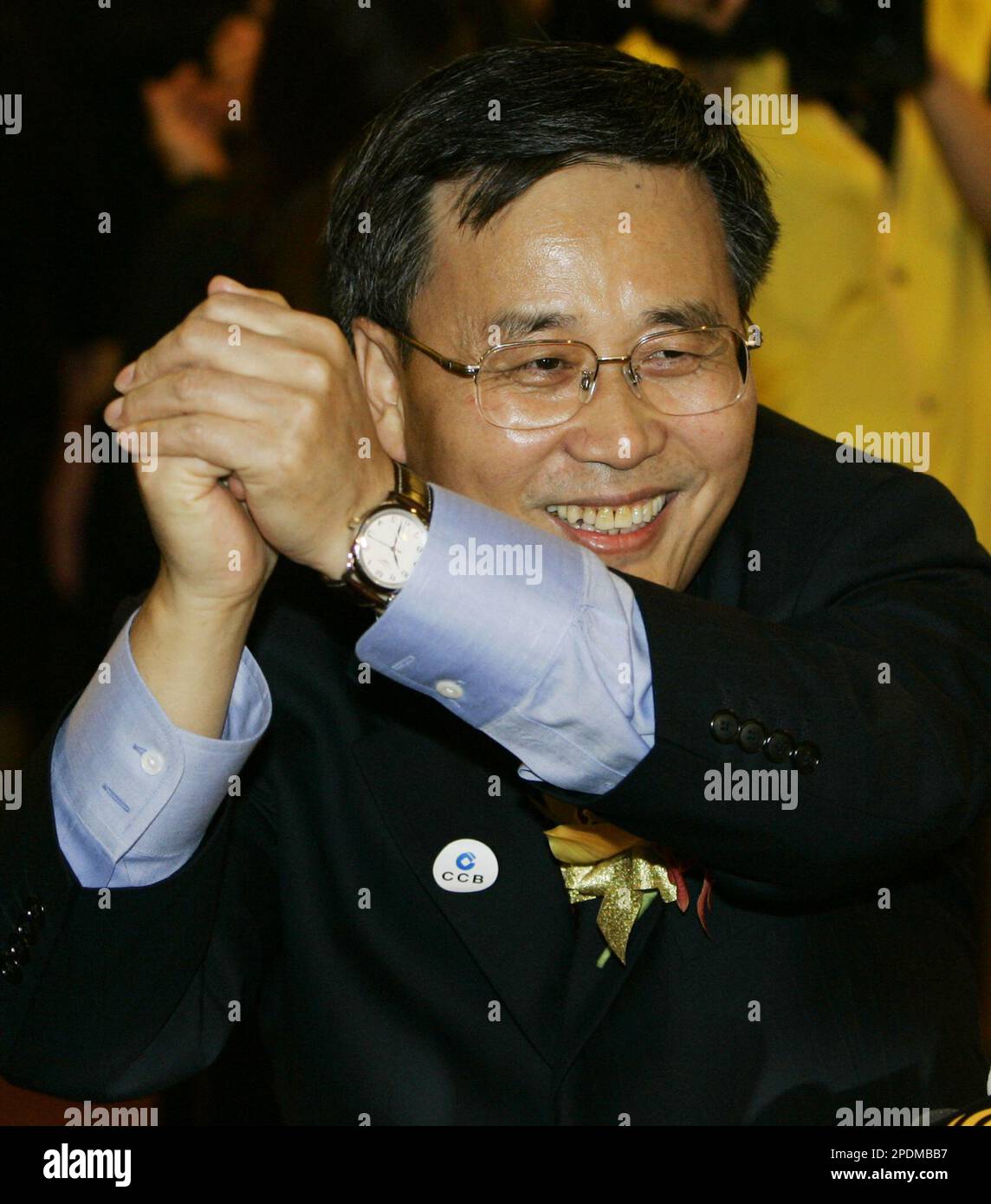 Guo Shuqing, chairman of China Construction Bank (CCB), gestures as ...