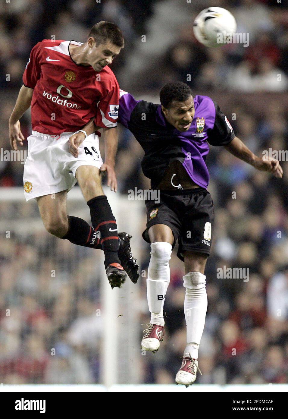 Manchester United's Ritchie Jones, left, gets the better of Barnet's ...