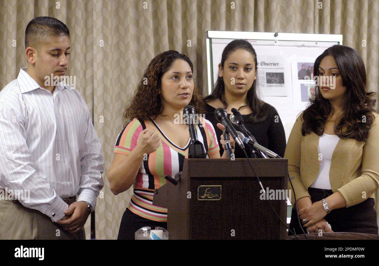 Rose Syriani, second from left, a daughter of Elias Syriani, talks to ...