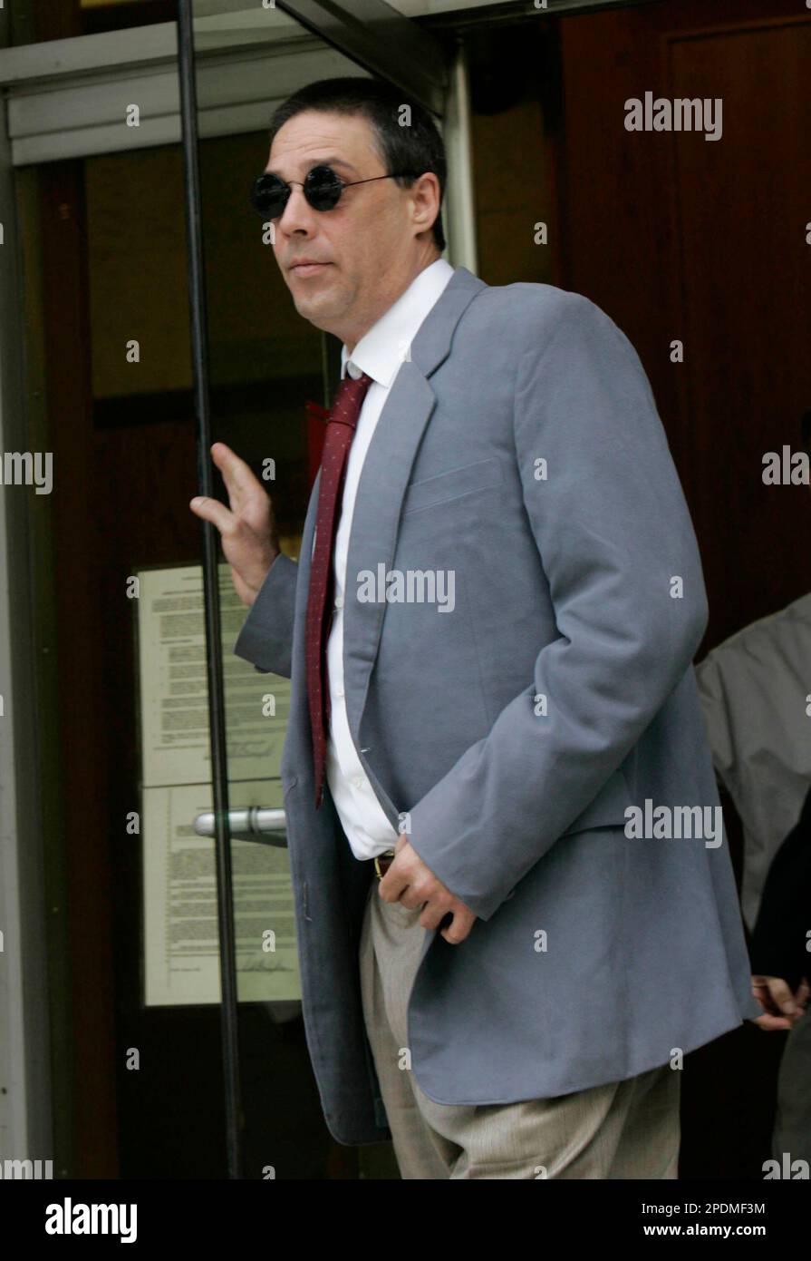 Christian Brando, the son of actor Marlon Brando, takes a break outside ...