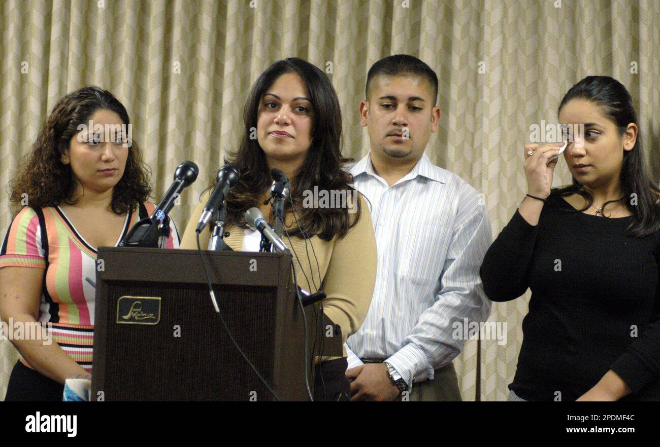 Sarah Barbari, second from left, a daughter of Elias Syriani, talks to ...
