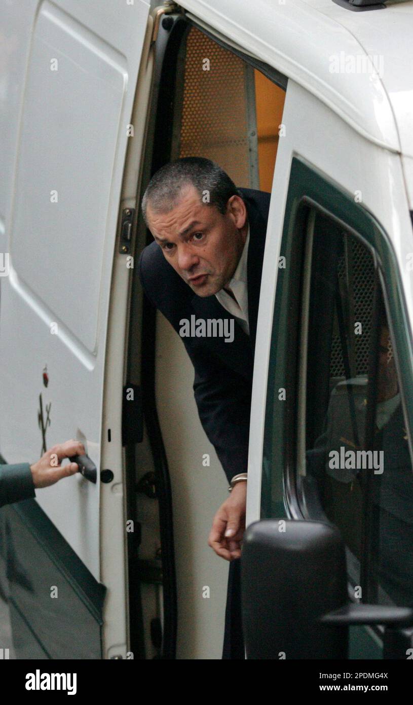 Former bartender Tony Alexander King of Britain is taken handcuffed ...