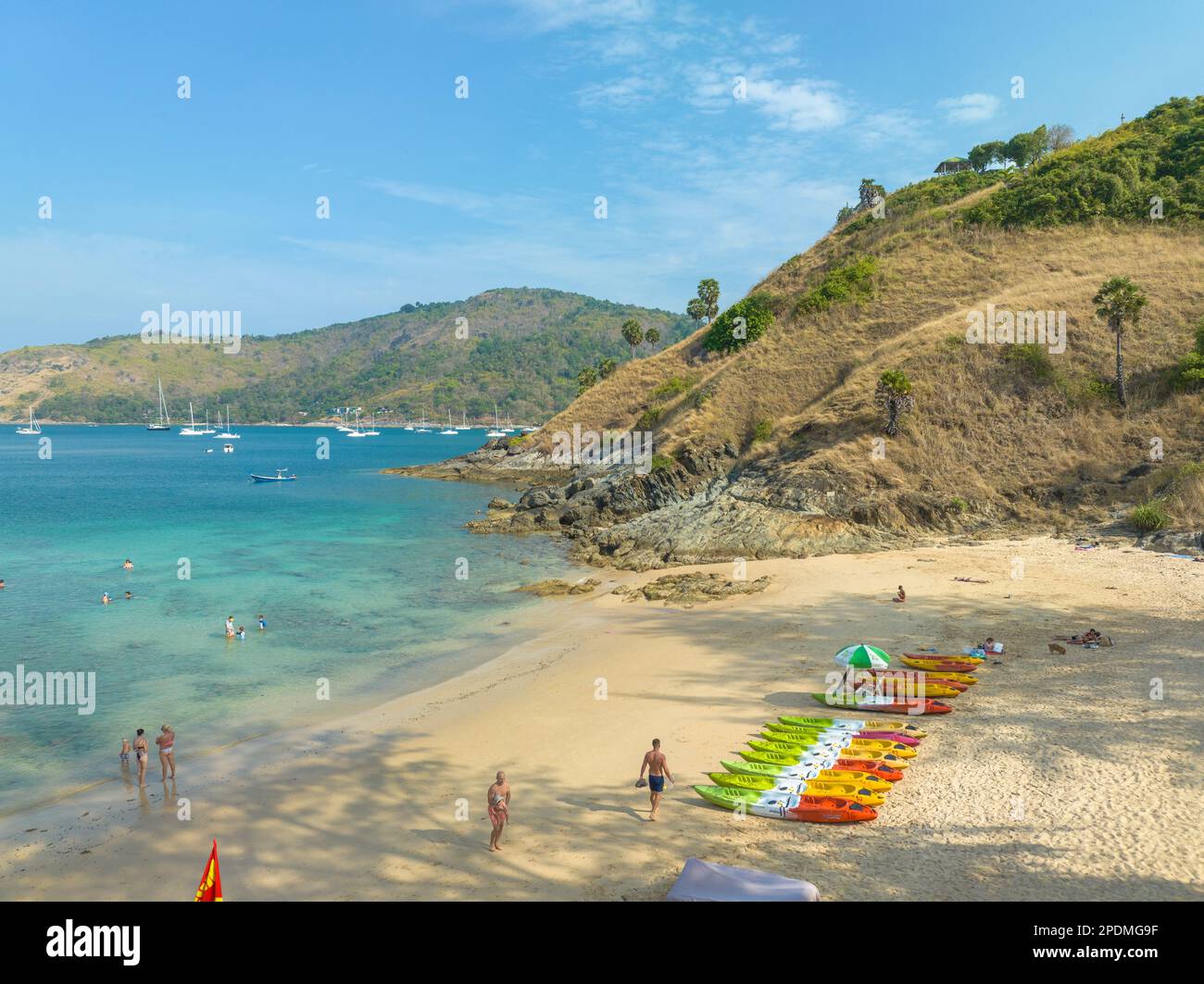 Aerial top view Colorful canoes are lined up in front of the beach. The ...