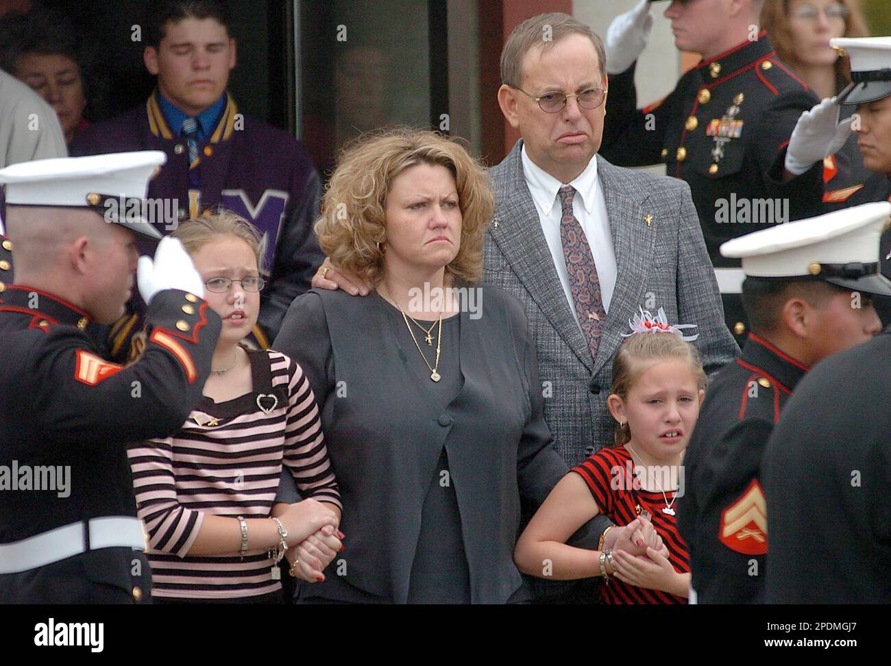 Bob and Coleen Hildebrandt, stand with their daughters, Amberly, left ...