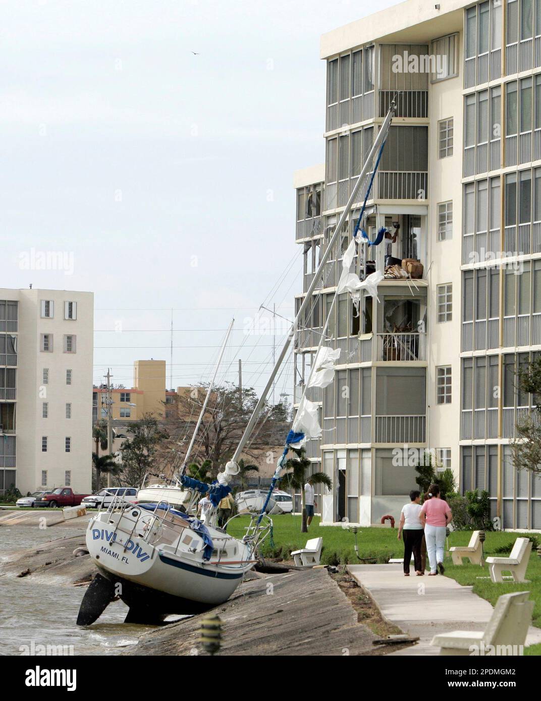 A sailboat sits on the sidewalk in the aftermath of Hurricane Wilma ...