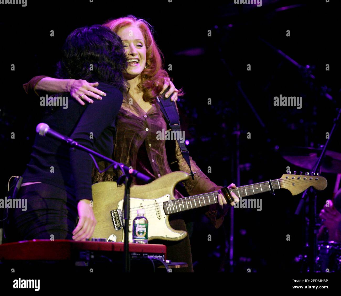 Rock singer/songwriter Bonnie Raitt, right, gives Maia Sharp who opened ...