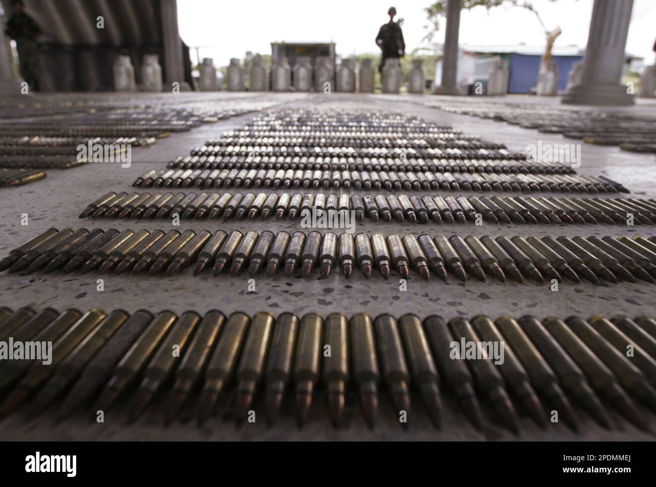 A soldier stands near thousands of bullets seized from Revolutionary ...