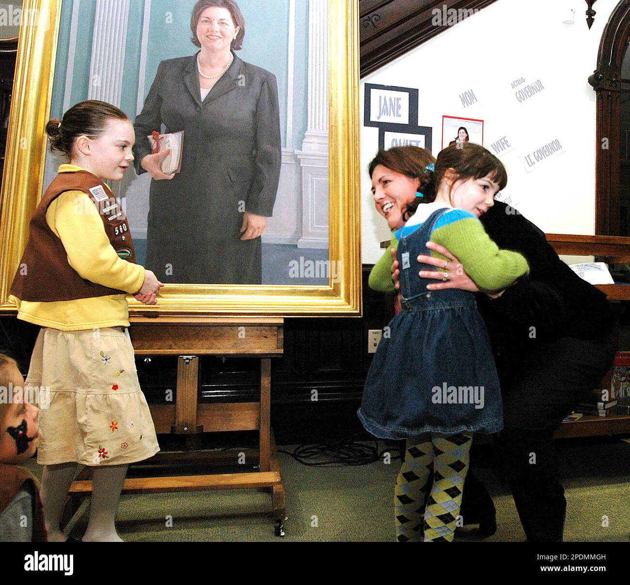 Former acting Gov. Jane Swift picks up one of her twin daughters, Sarah ...