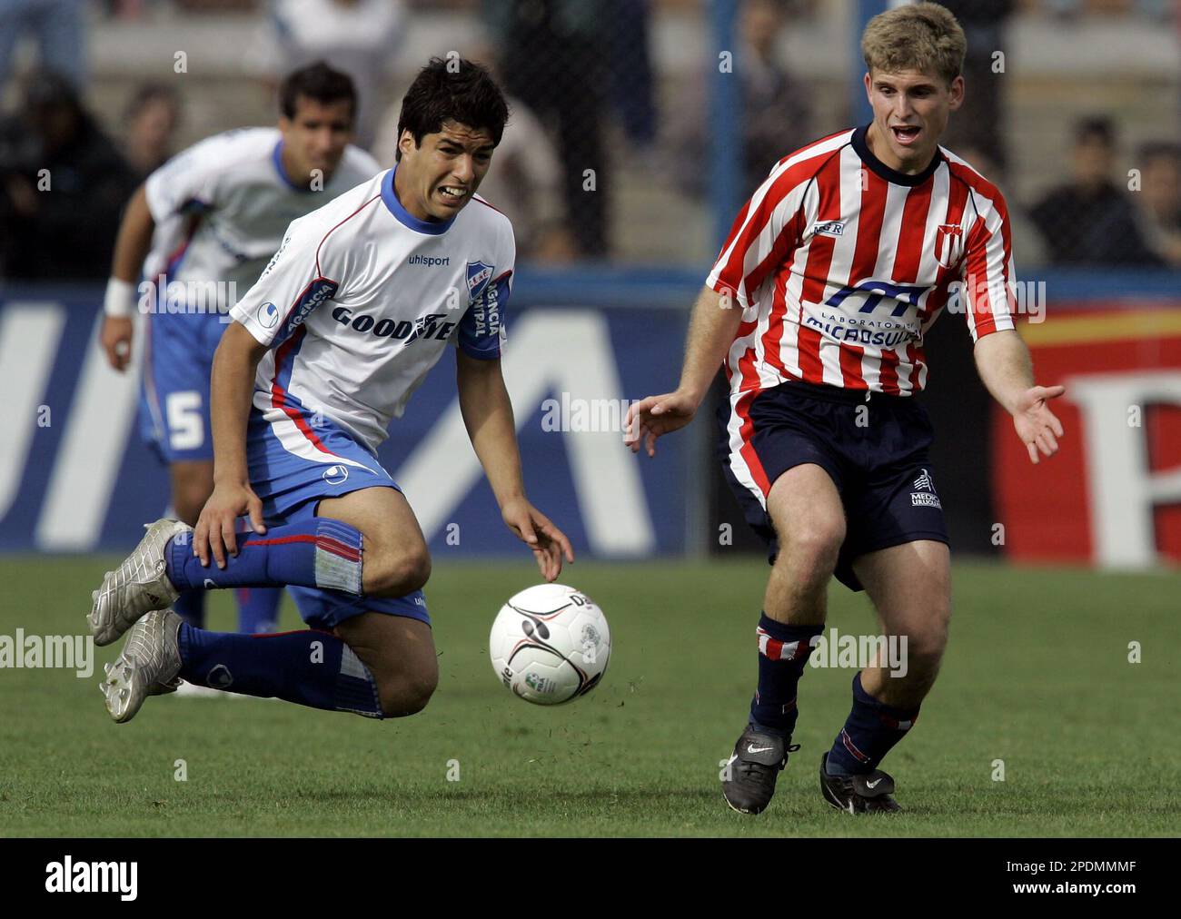 Uruguay's Nacional's Luis Suarez, left, battles for the ball with ...