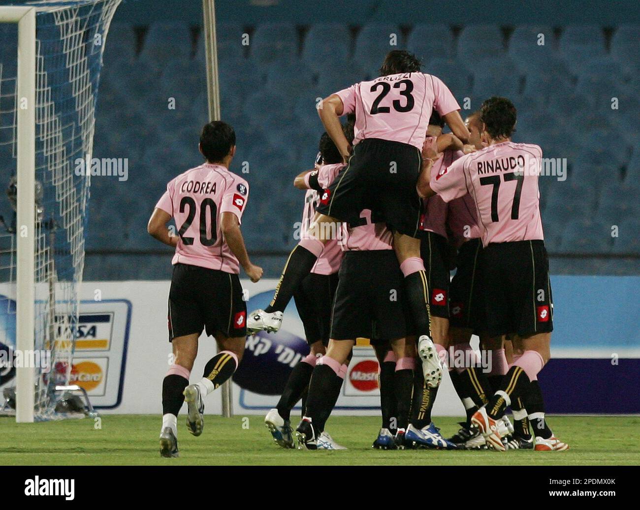 Palermo players celebrate Franco Brienza's goal against Maccabi Petach ...