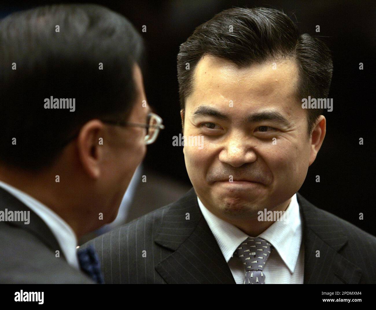 Hong Kong's new justice secretary Wong Yan Lung, right, looks at cheif ...