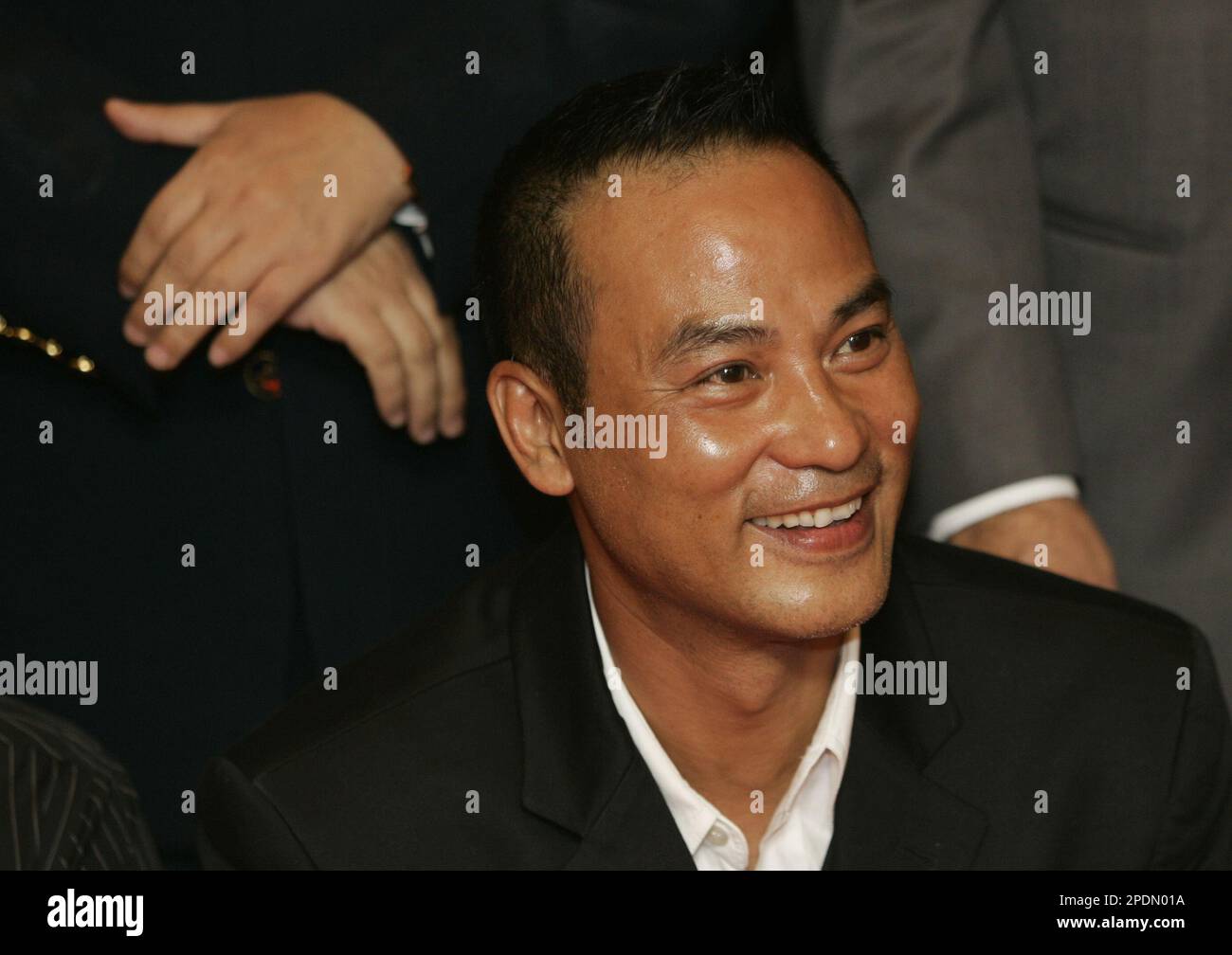 Hong Kong actor Simon Yam poses during his movie premiere "Election" in ...
