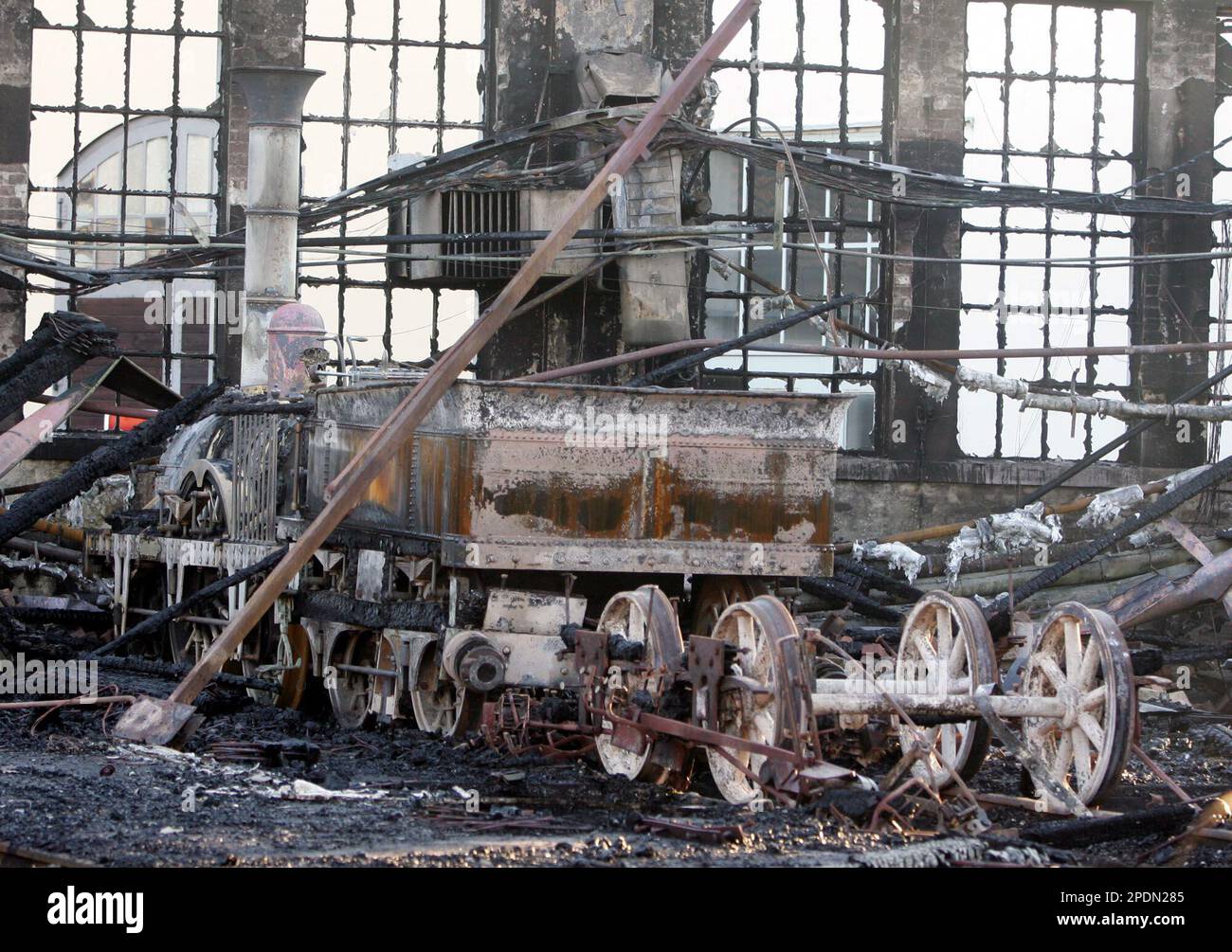 A damaged train is seen in the burned out museum of German railway ...