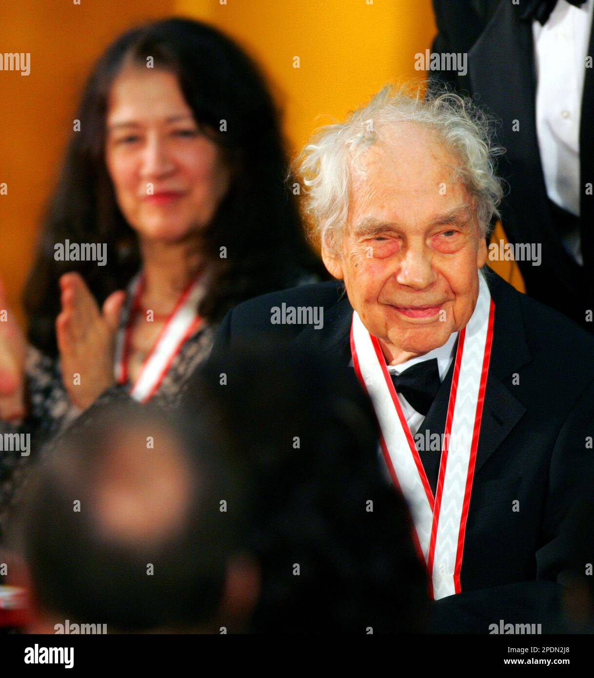 Merce Cunningham, American choreographer, right, is congratulated by ...