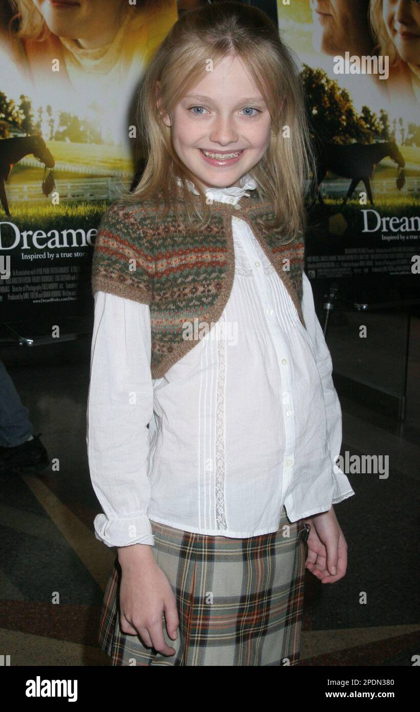 Actress Dakota Fanning poses for photographers as she arrives for a ...