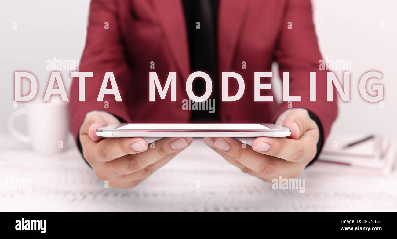 Hand writing sign Data Modeling. Internet Concept process of ...