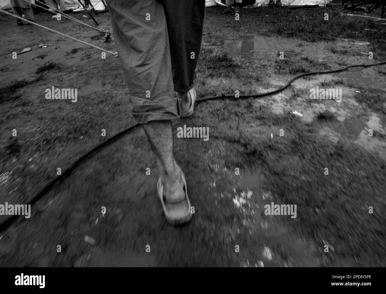 Pakistani Doctor Intisar Rashid, wearing plastic sandals wades through ...