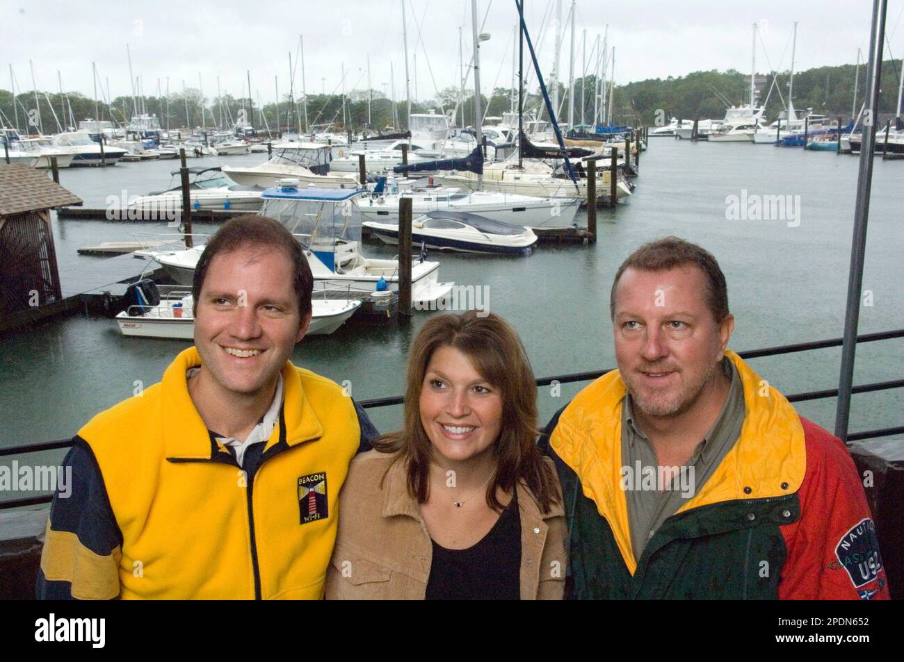 Russell Schmidt left, poses with his business partners Melissa Symeon ...