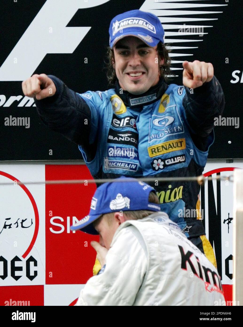 Spanish Formula One world champion Fernando Alonso celebrates on the ...