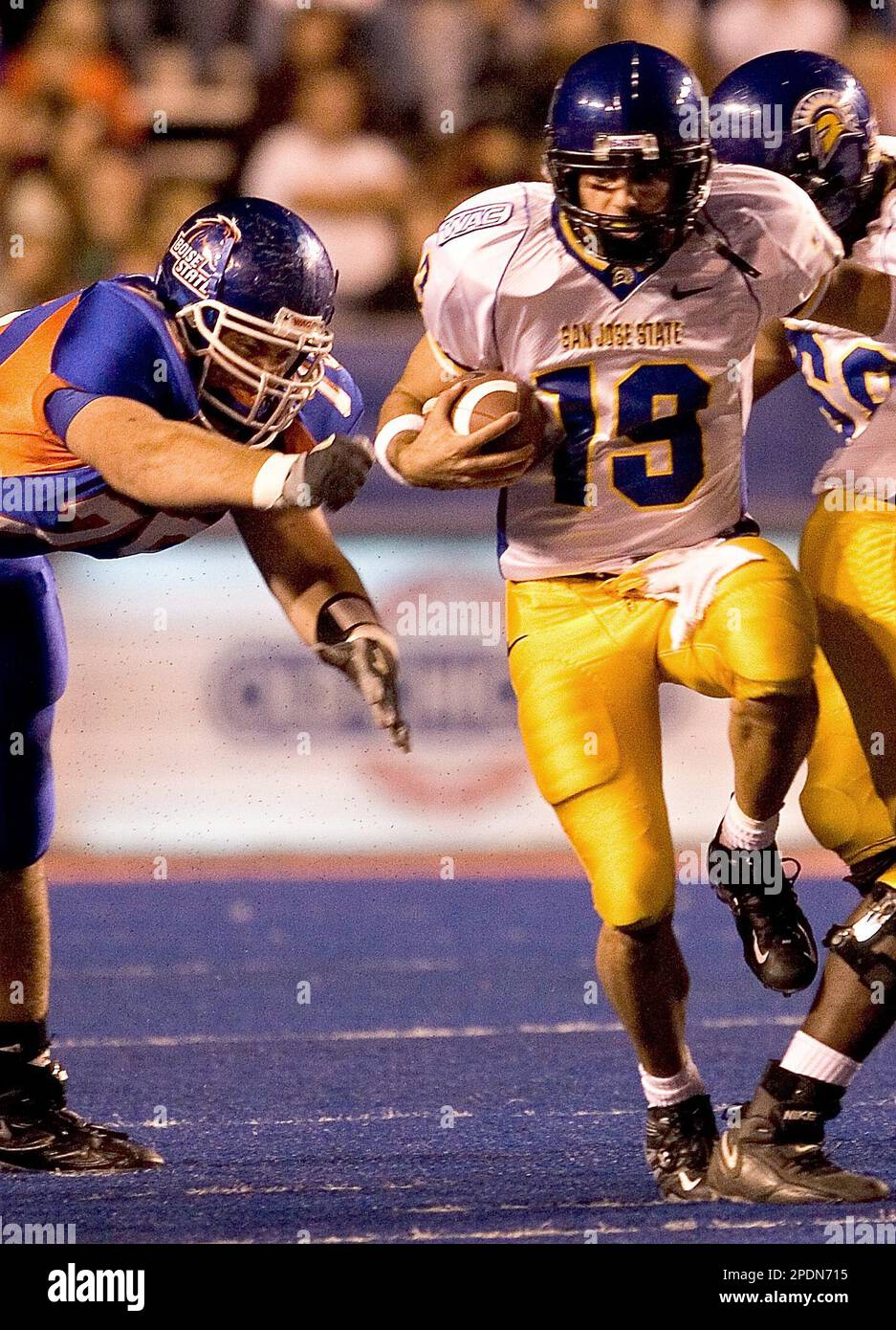 San Jose State's J.P. Greco (19) breaks a tackle attempt of Boise State ...