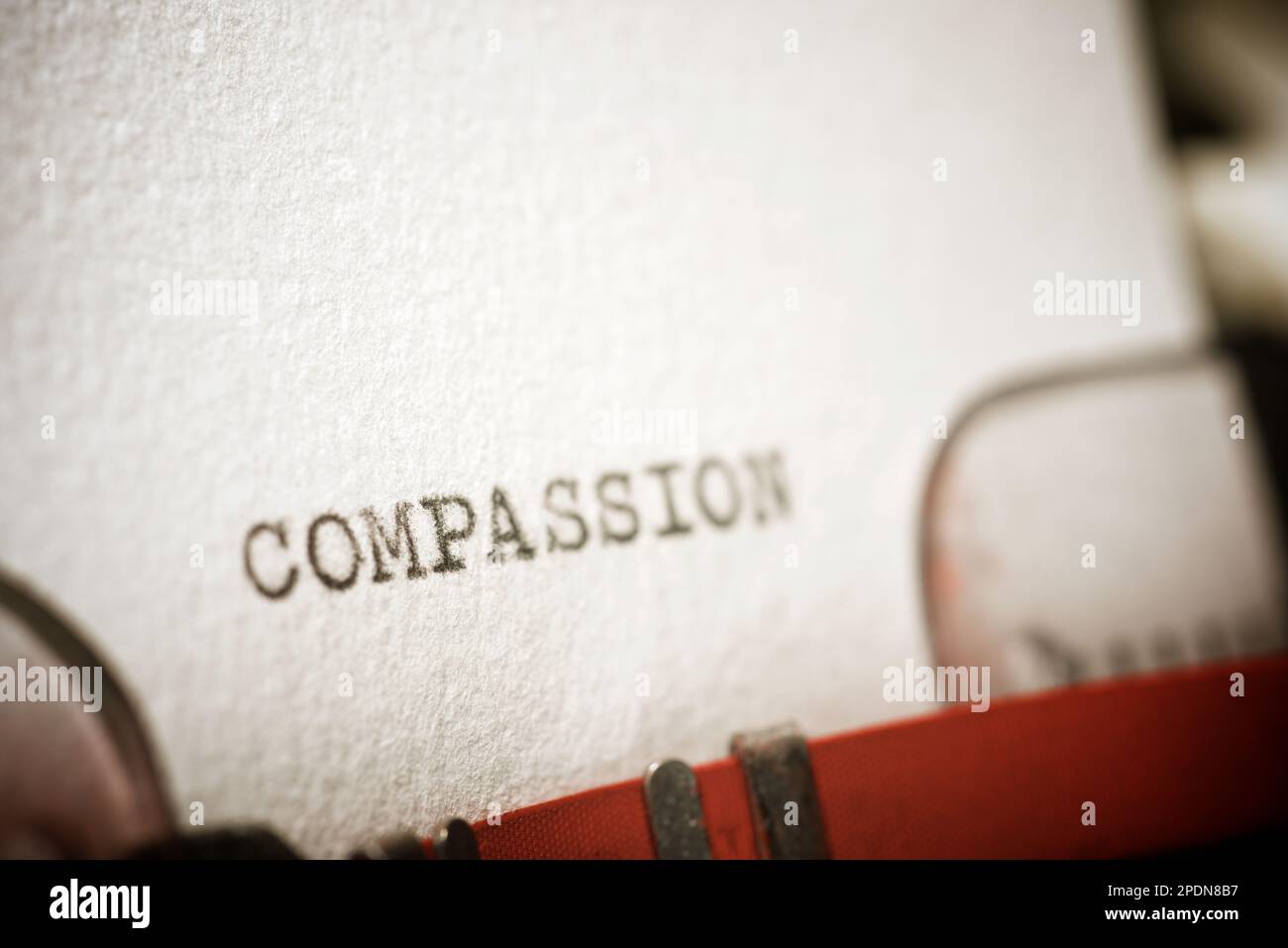 Compassion word written with a typewriter Stock Photo - Alamy