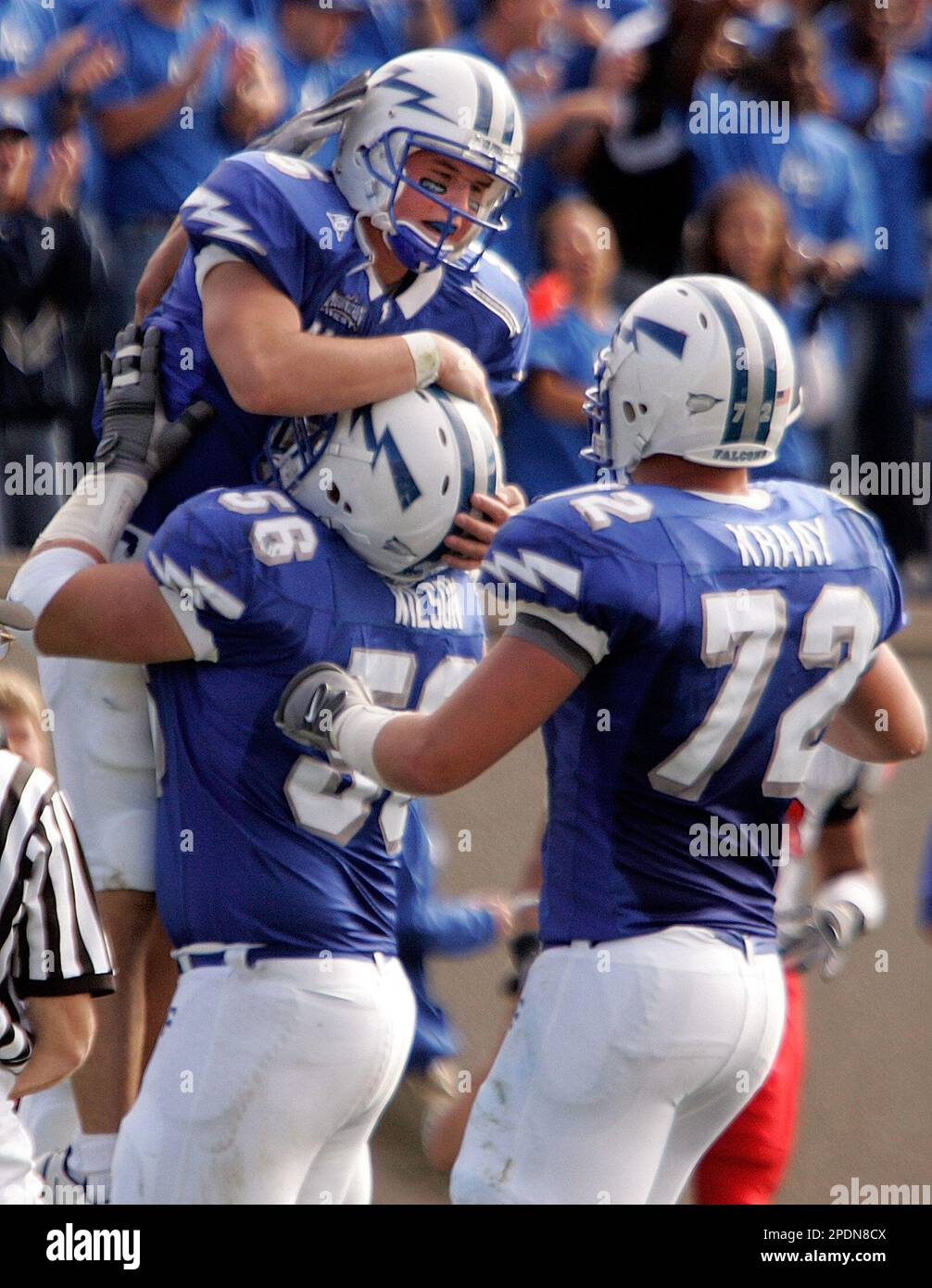 Air Force quarterback Shaun Carney, top left, celebrates his touchdown ...