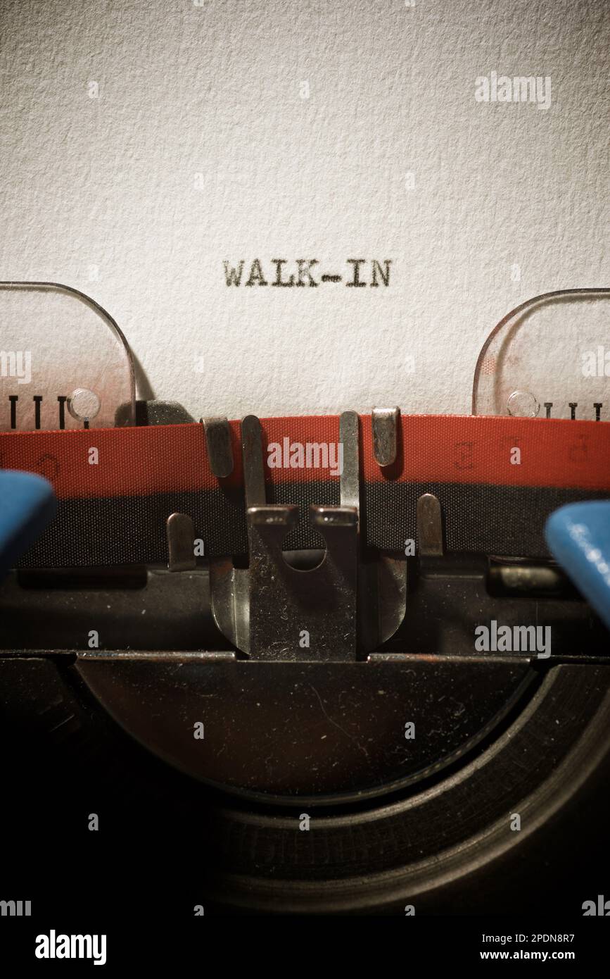 Walk-in word written with a typewriter Stock Photo - Alamy