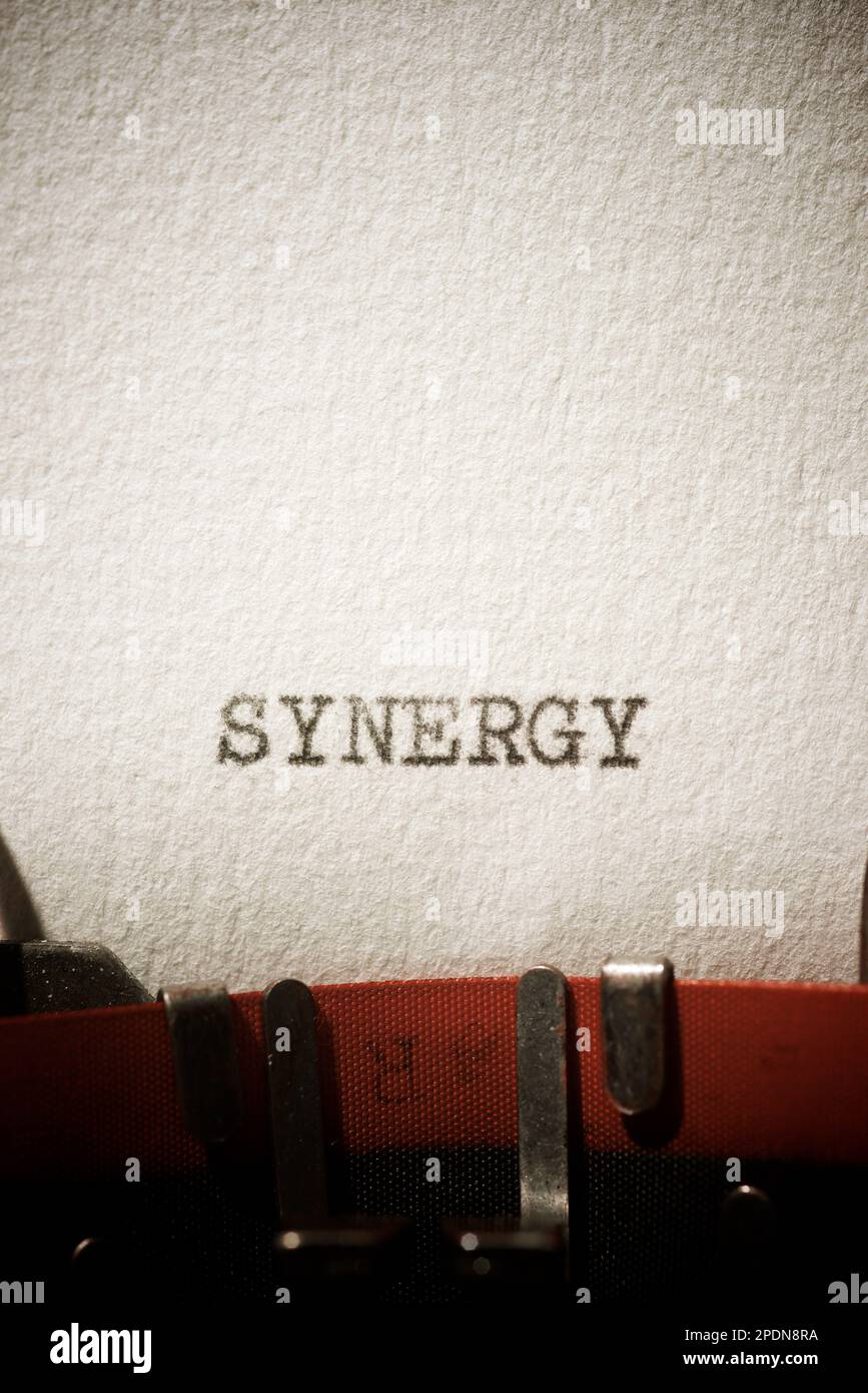 Synergy word written with a typewriter Stock Photo - Alamy