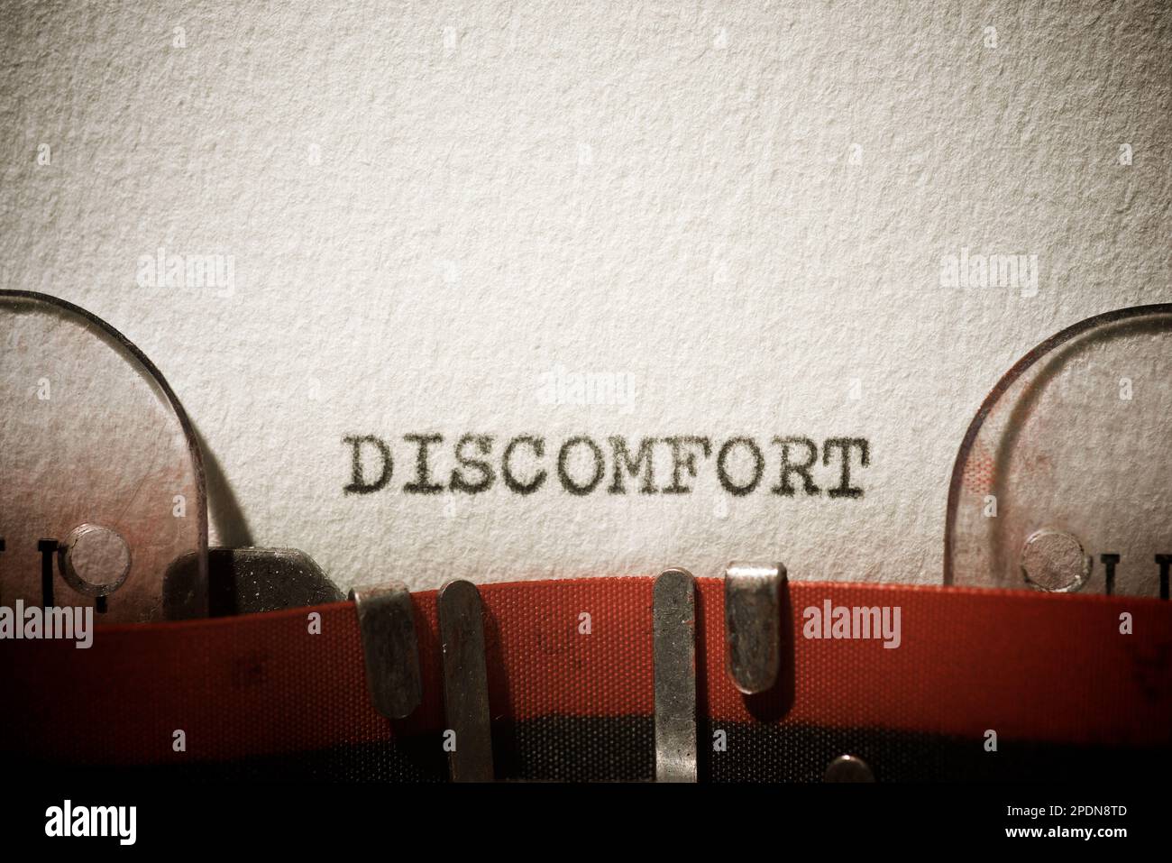 Discomfort word written with a typewriter Stock Photo - Alamy